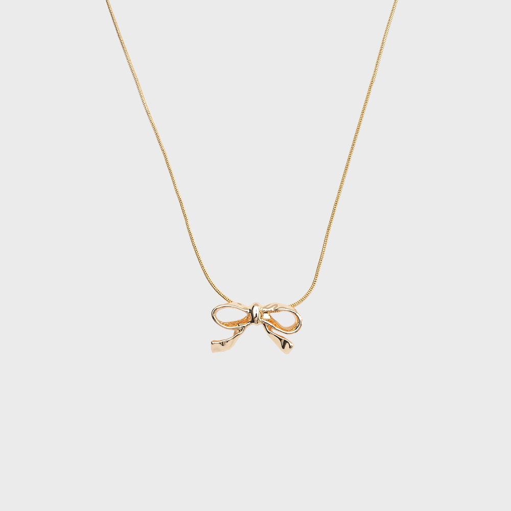 PETRA GOLD BOW NECKLACE – Butrich Worldwide